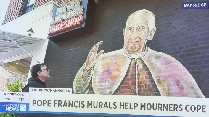 People Left Roses Under the Painting of Pope Outside of Little Cupcake ...